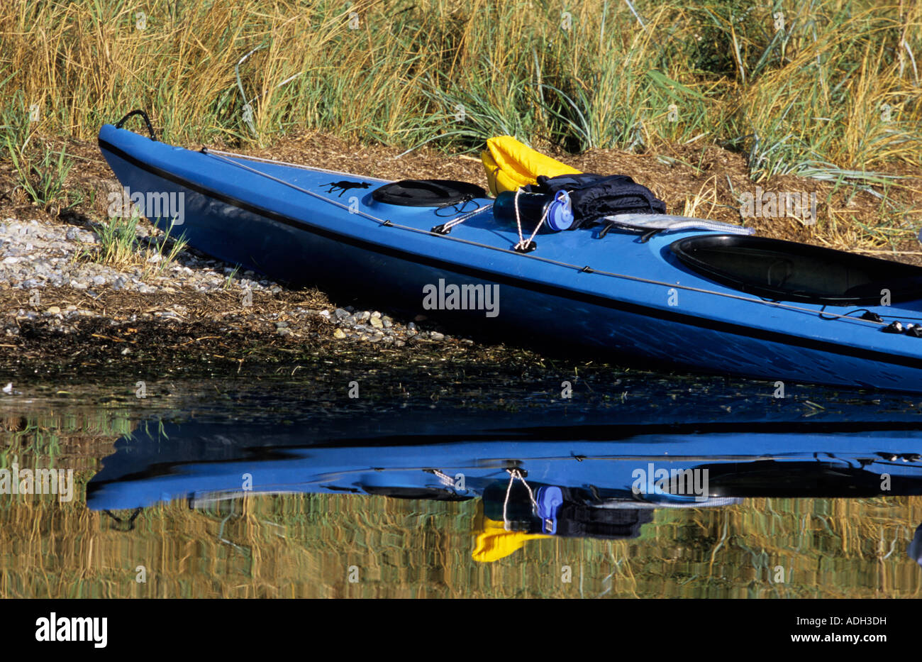 One Kayak lying ashore with reflection Ruegen August 2005 Stock Photo ...