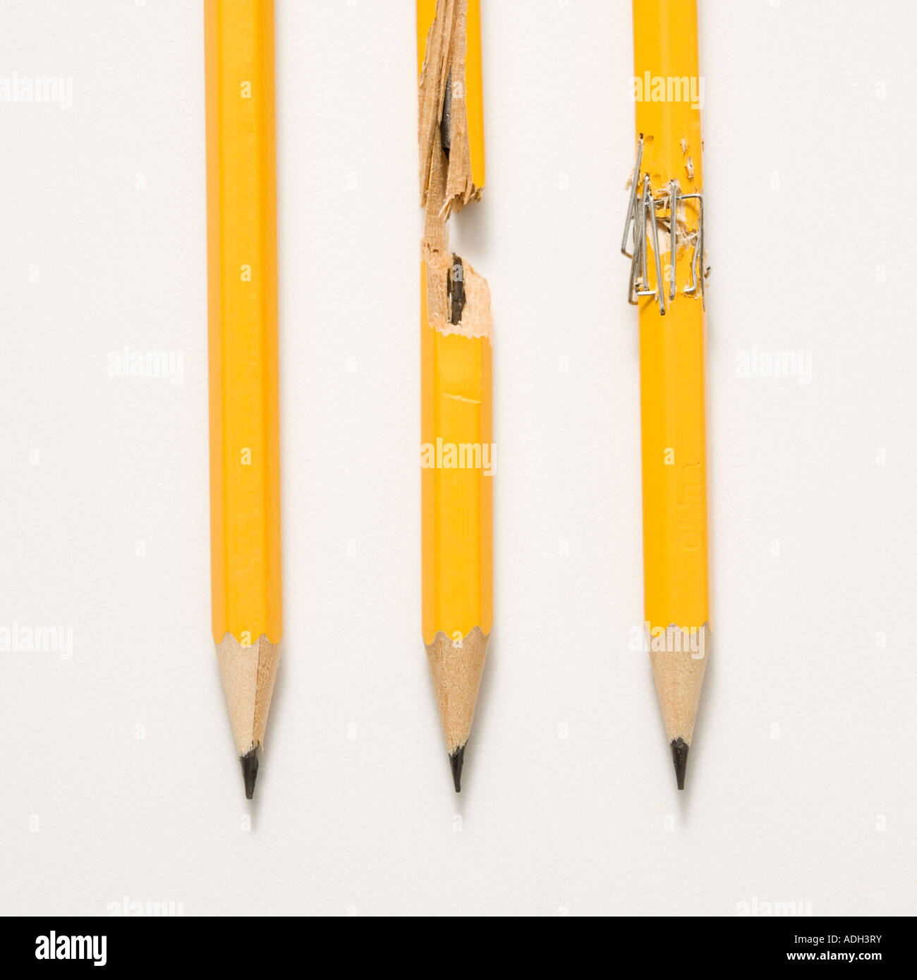 Whole pencil broken pencil and stapled together pencil lined up against ...