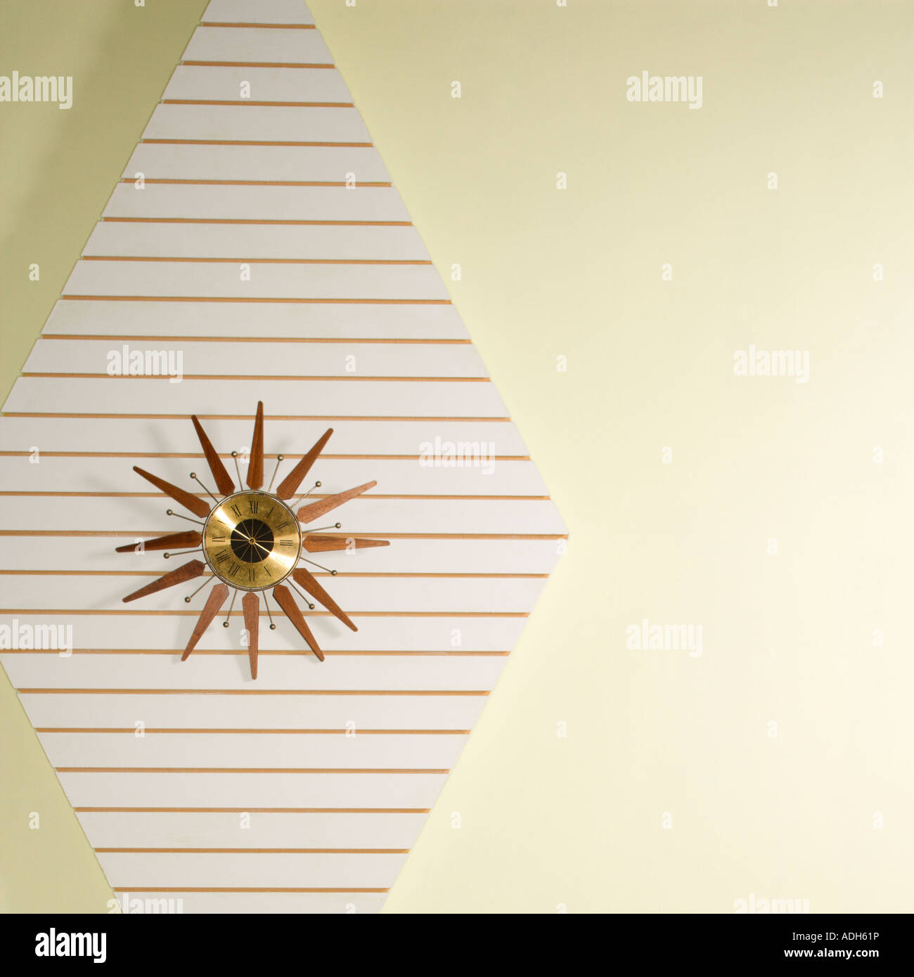 Retro star shaped clock hanging on wall Stock Photo - Alamy