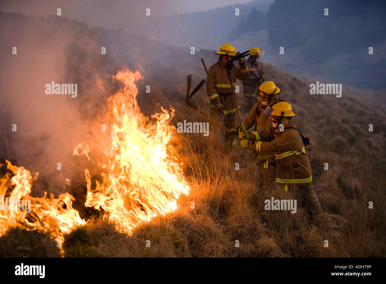 Firemen beating fire hi-res stock photography and images - Alamy