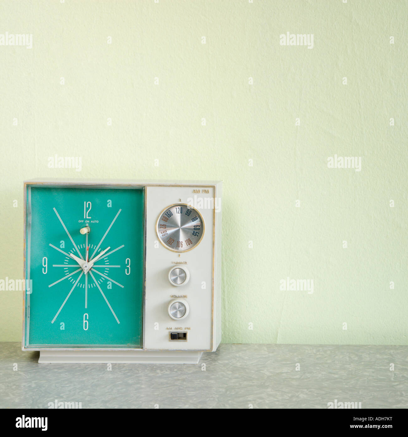 Still life of vintage clock radio with turquois face Stock Photo - Alamy
