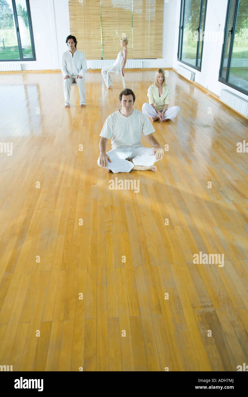 Group meditation, adults in various meditative positions Stock Photo ...