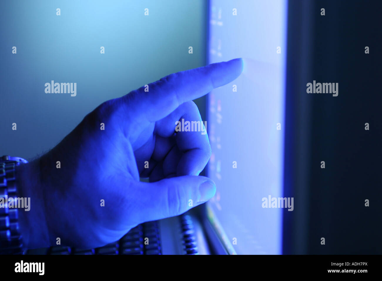 finger on the monitor Stock Photo - Alamy