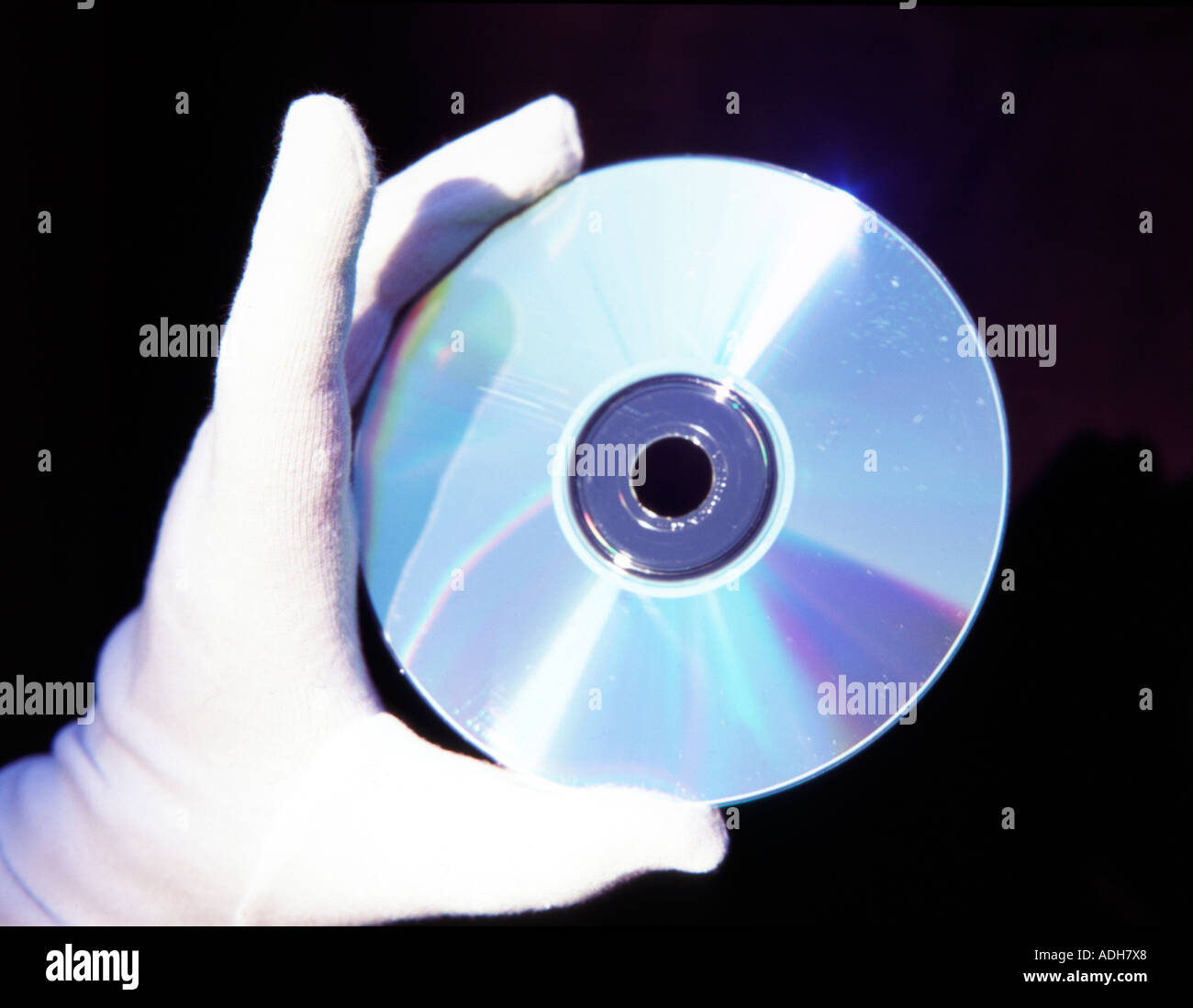 Hand holding cd-rom Stock Photo - Alamy