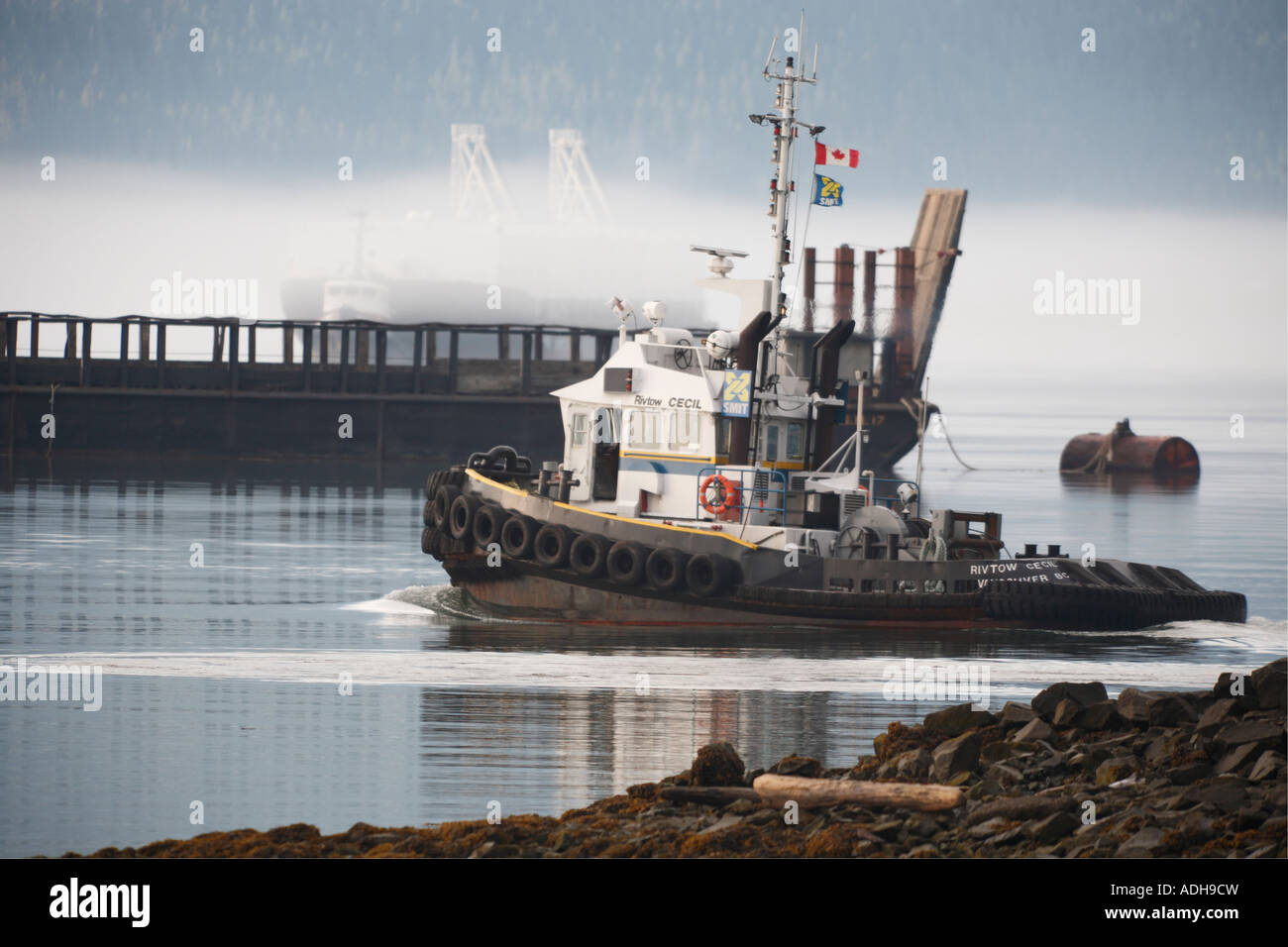 Tugboat at work Rio Tinto/Alcan aluminum smelter dock Kitimat British ...