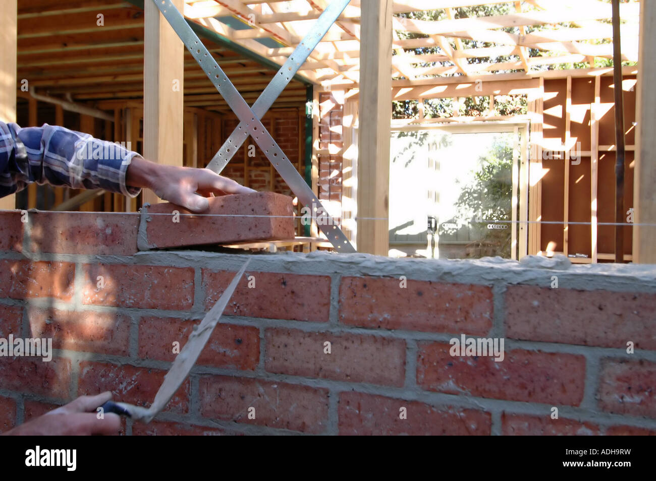 bricklayer building a wall Stock Photo - Alamy
