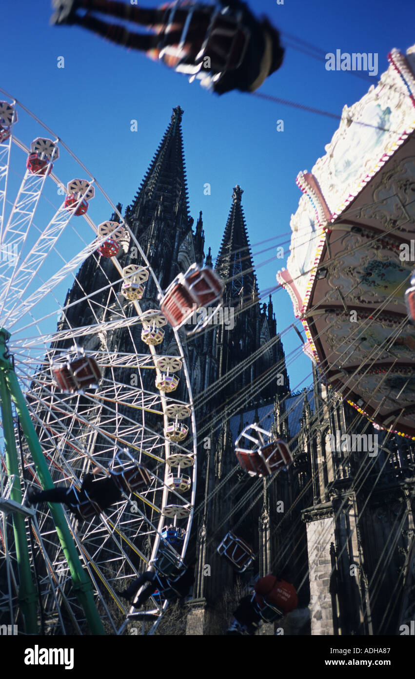 Funfair by Cologne cathedral during carnival Stock Photo - Alamy