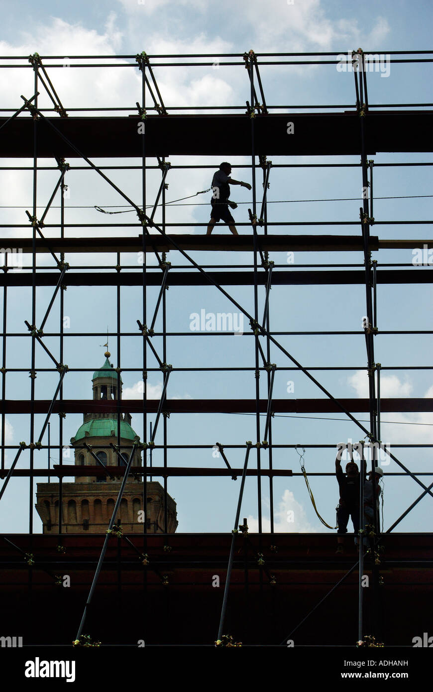 Construction workers in Italy using safety harnesses on scaffolding ...