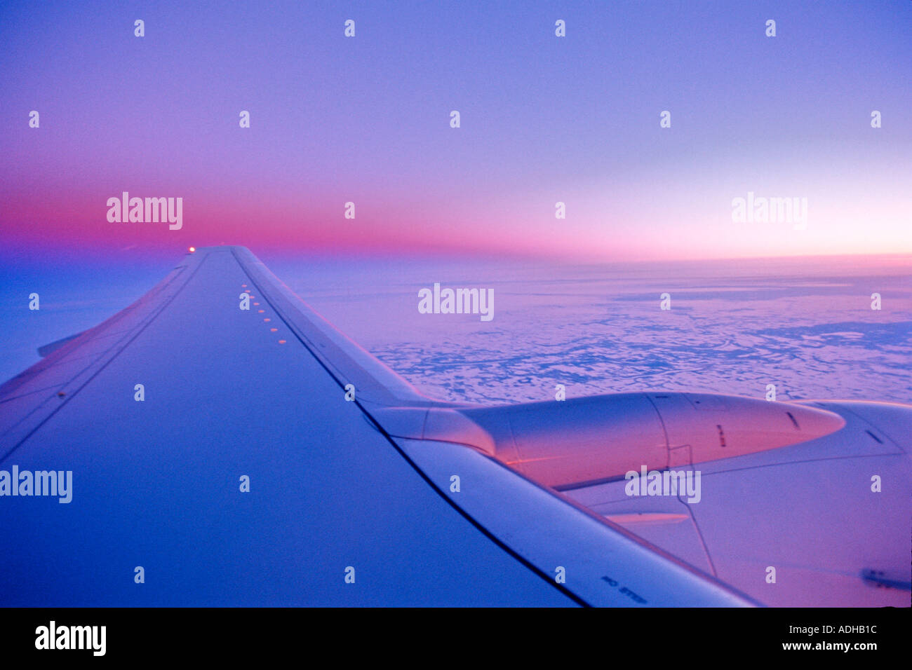 A horizontal image of a Wing of a 737 at Sunrise Stock Photo - Alamy