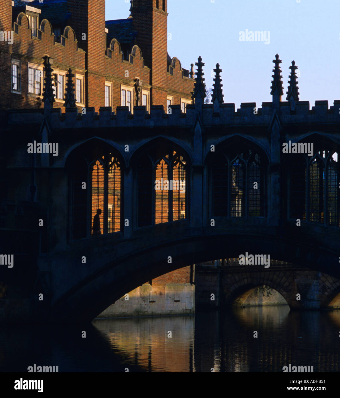 A solitary figure crosses the River Cam at Cambridge University Stock ...