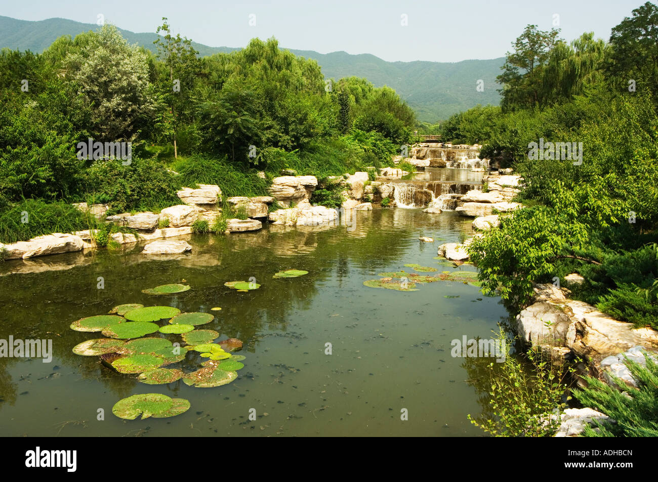 waterfall feature with Western Hills behind Beijing Botanical Gardens ...