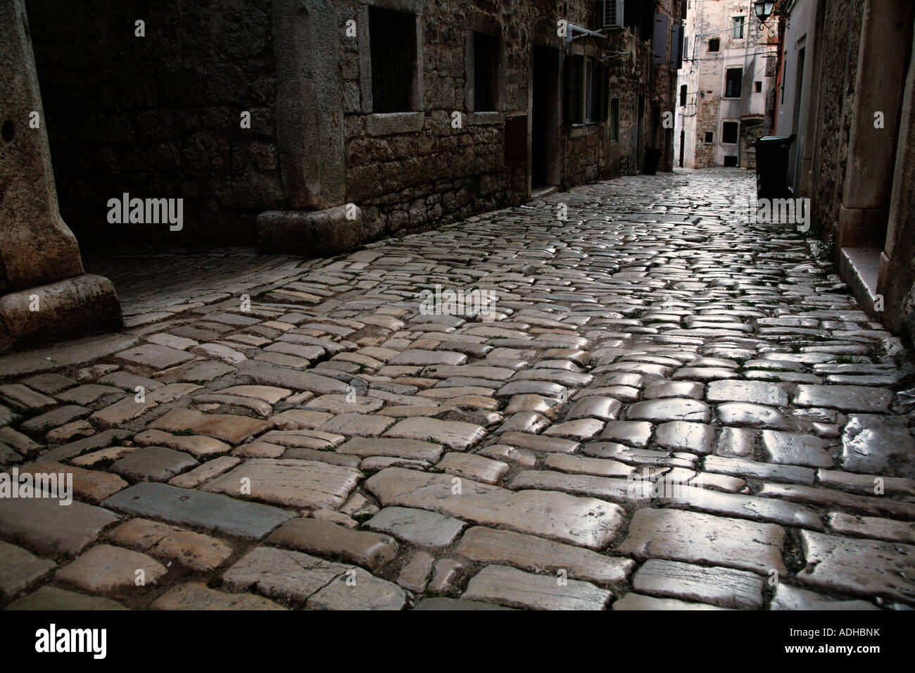 Shiny worn cobble stones in narrow street in Rovinj Croatia Stock Photo ...