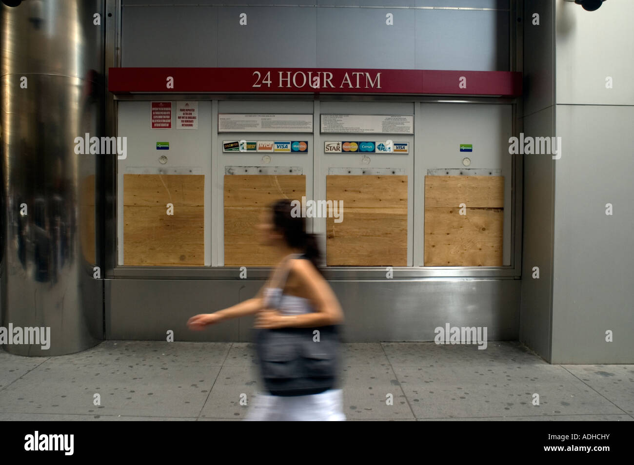 Closed and boarded up bank ATM machines on Lower Broadway in NYC Stock ...