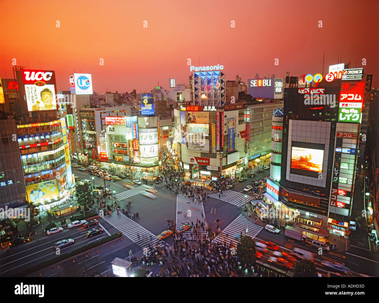 Pedestrians filling crosswalks in Shibuya district of Tokyo under ...