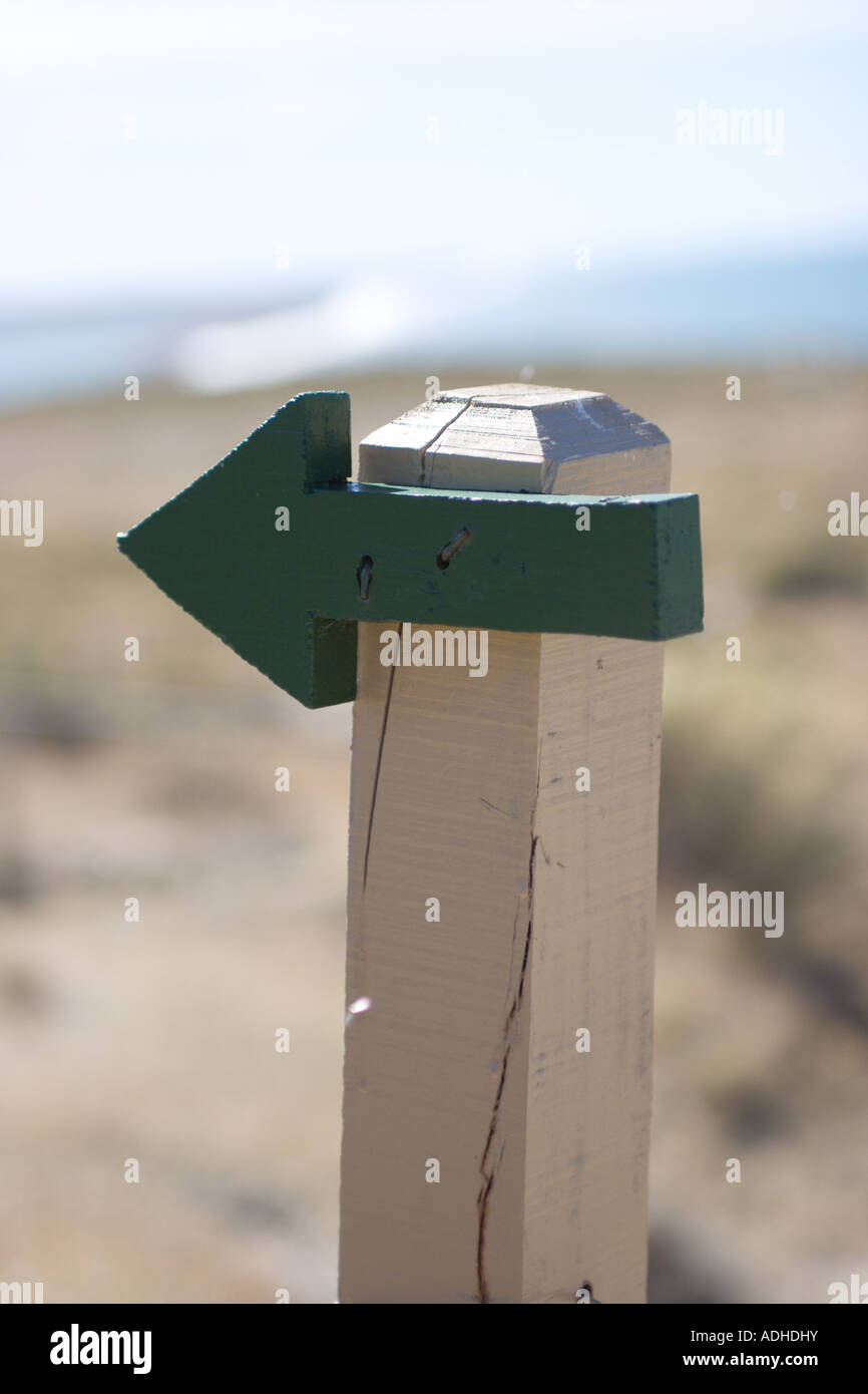 Turn left wooden sign Stock Photo - Alamy