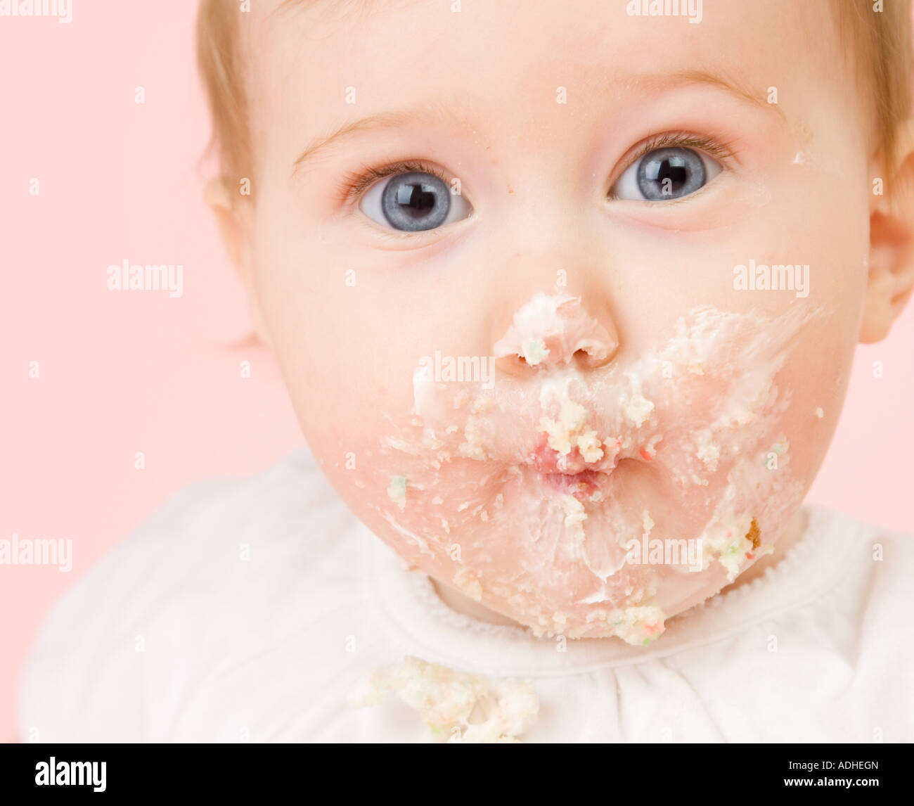 Baby enjoying First Birthday cake Stock Photo - Alamy