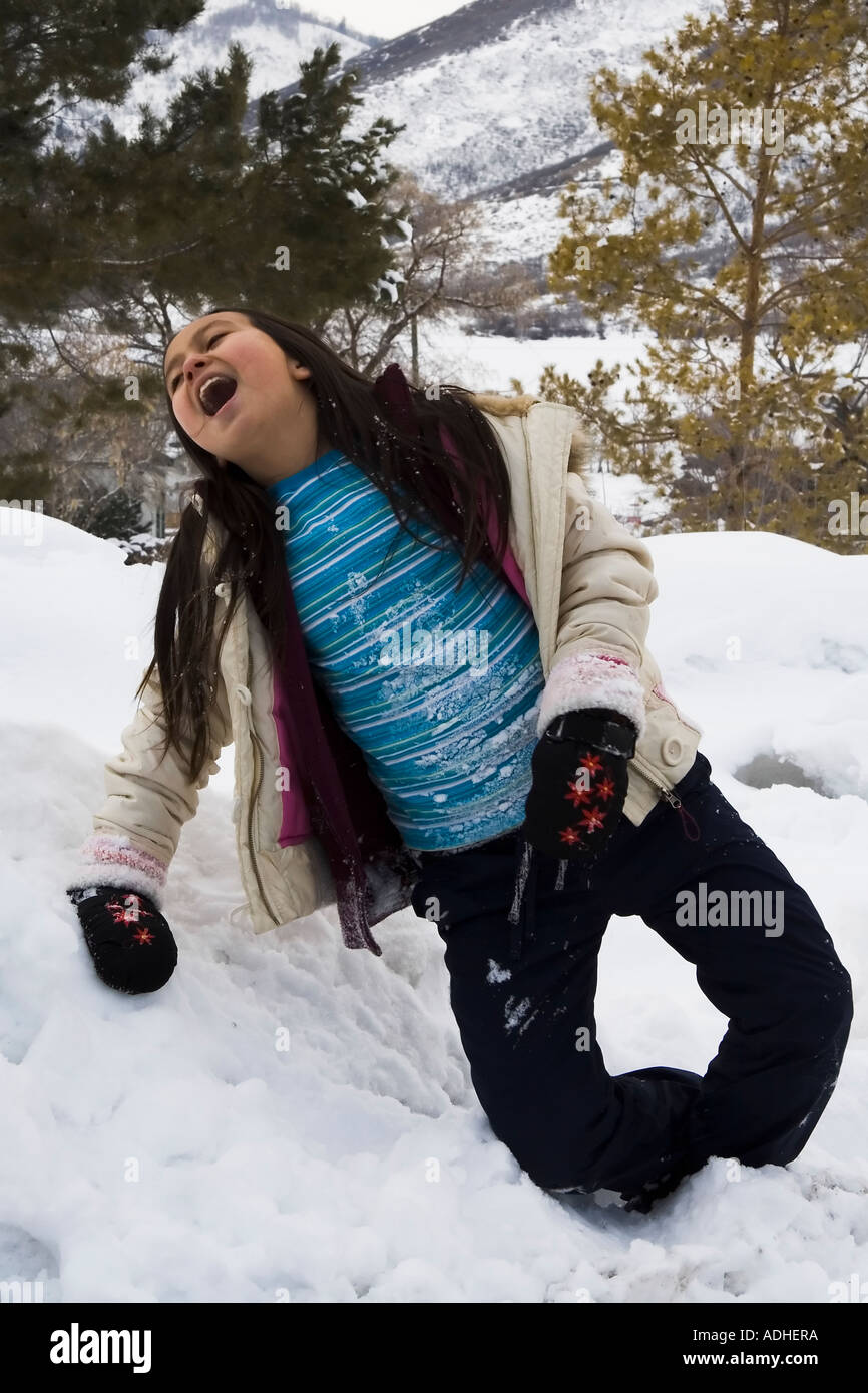 Girl with snow falling down her shirt Stock Photo - Alamy