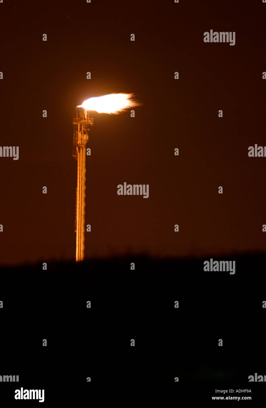 Flame erupting from flare stack at oil refinery Stock Photo - Alamy