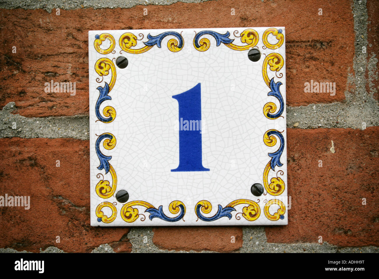 Number one ceramic tile house number on a brick wall, England UK Stock ...