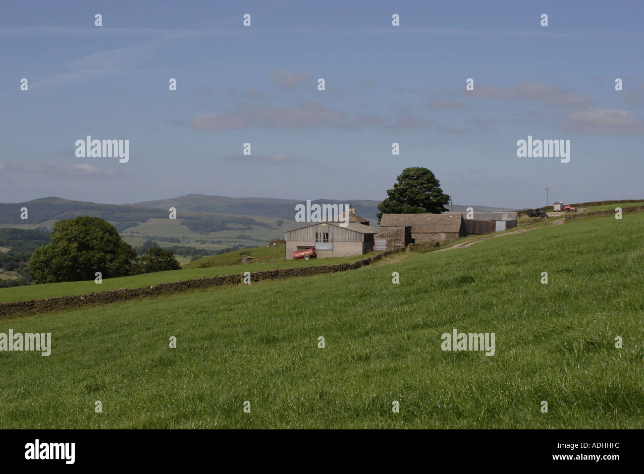 Farm buildings nestling in the hills close to the Pennine Way Stock ...