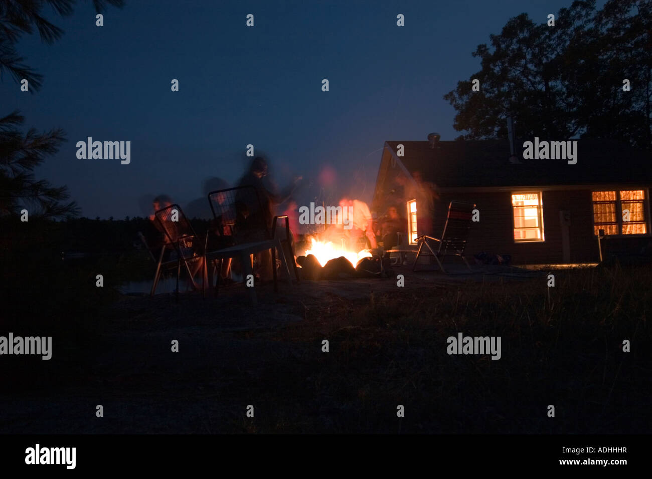 Campfire and cottage Stock Photo - Alamy