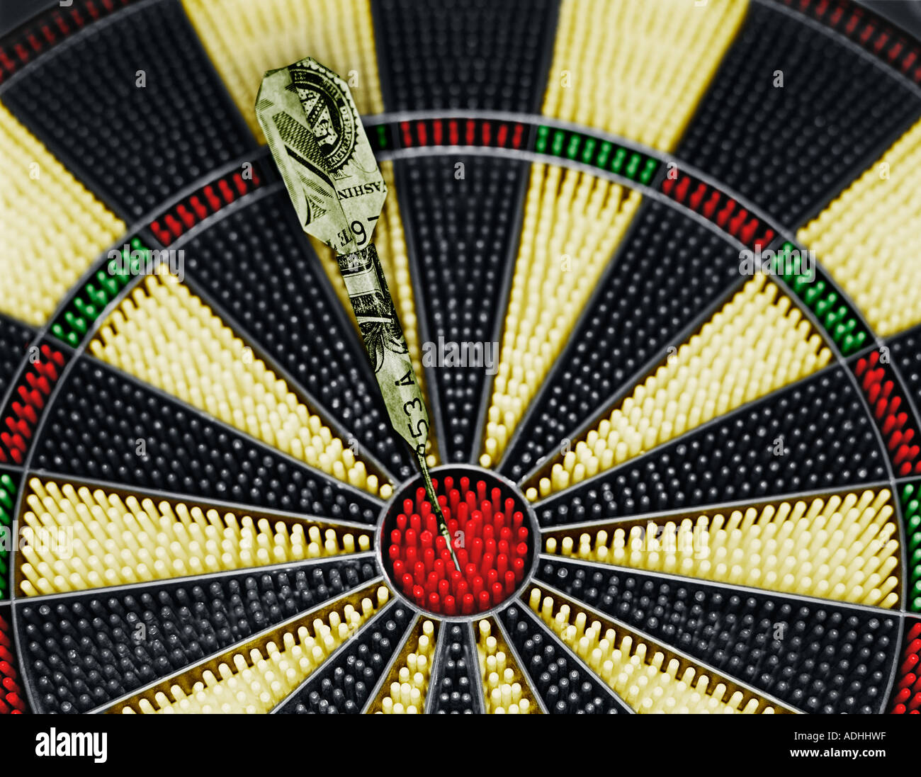 Origami dollar bill in shape of dart hitting bulls eye of target Stock ...