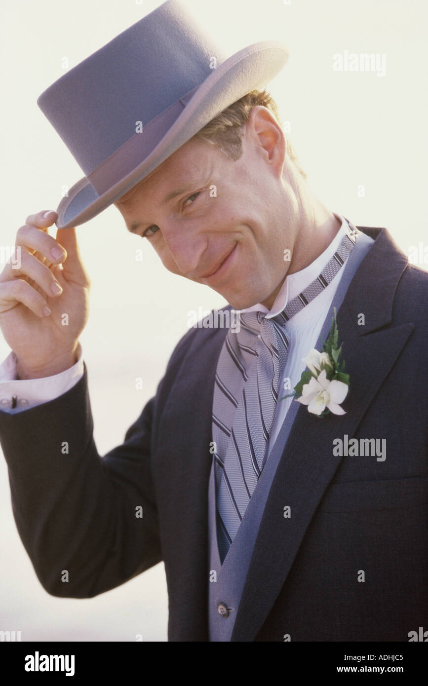 Portrait of a groom wearing a hat smiling Stock Photo - Alamy