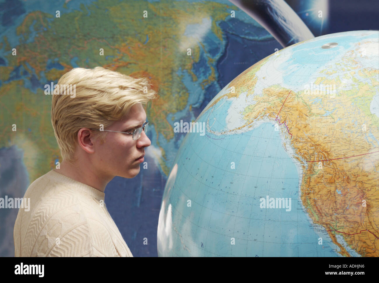 Person looking at world globe hi-res stock photography and images - Alamy