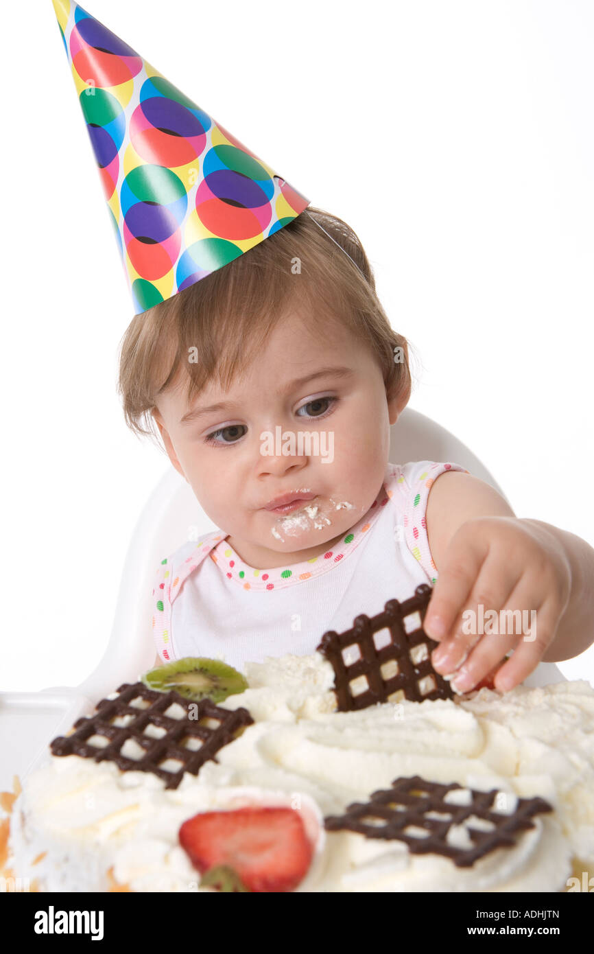 One year old baby girl eating from her birthday cake Stock Photo - Alamy
