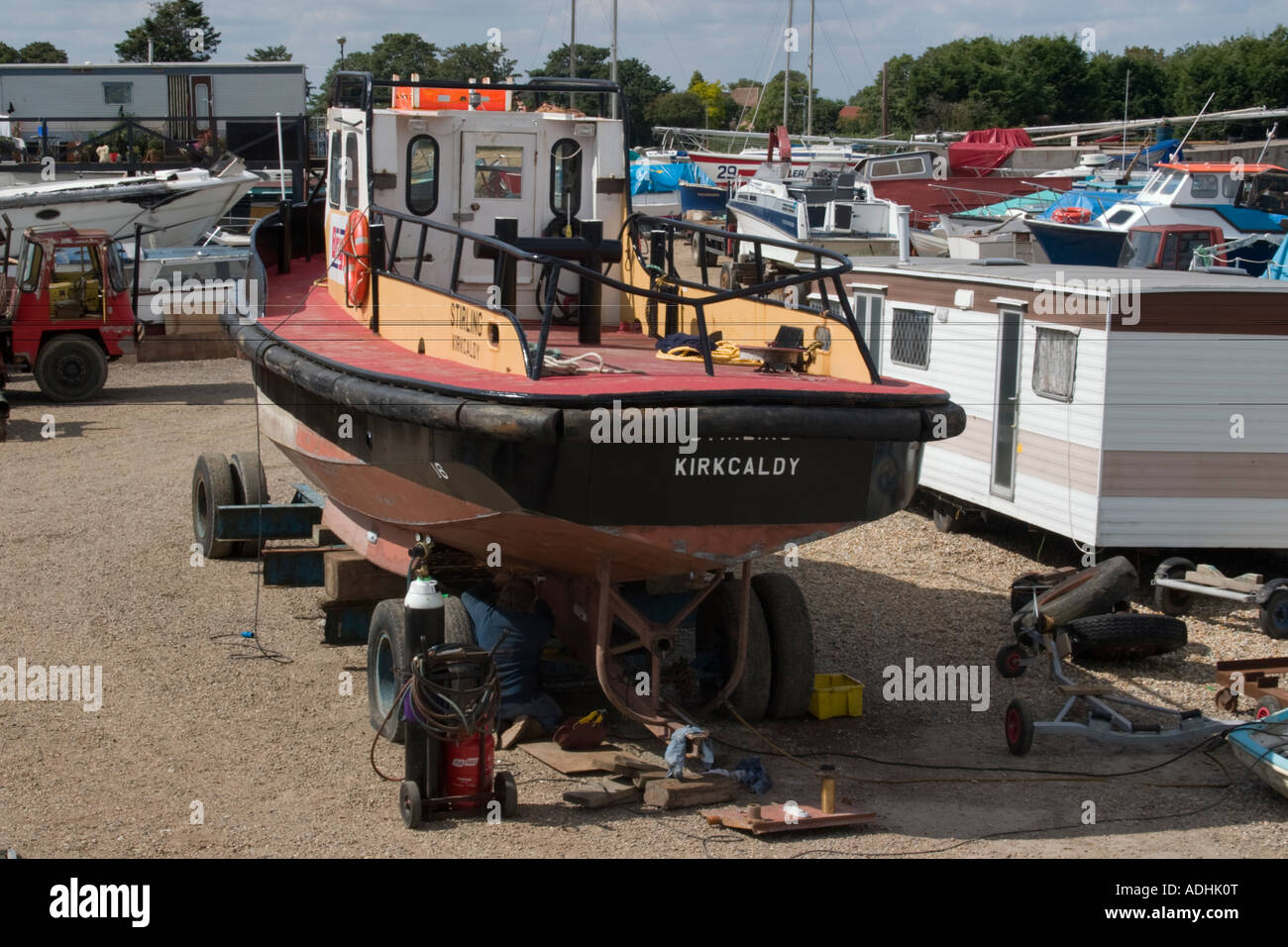 Working on a small tugboat in the yard at Paglesham Stock Photo - Alamy