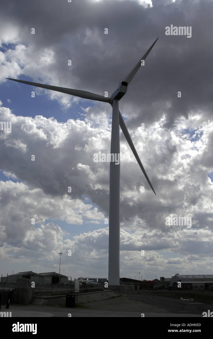Wind turbine against dramatic rain clouds Stock Photo - Alamy