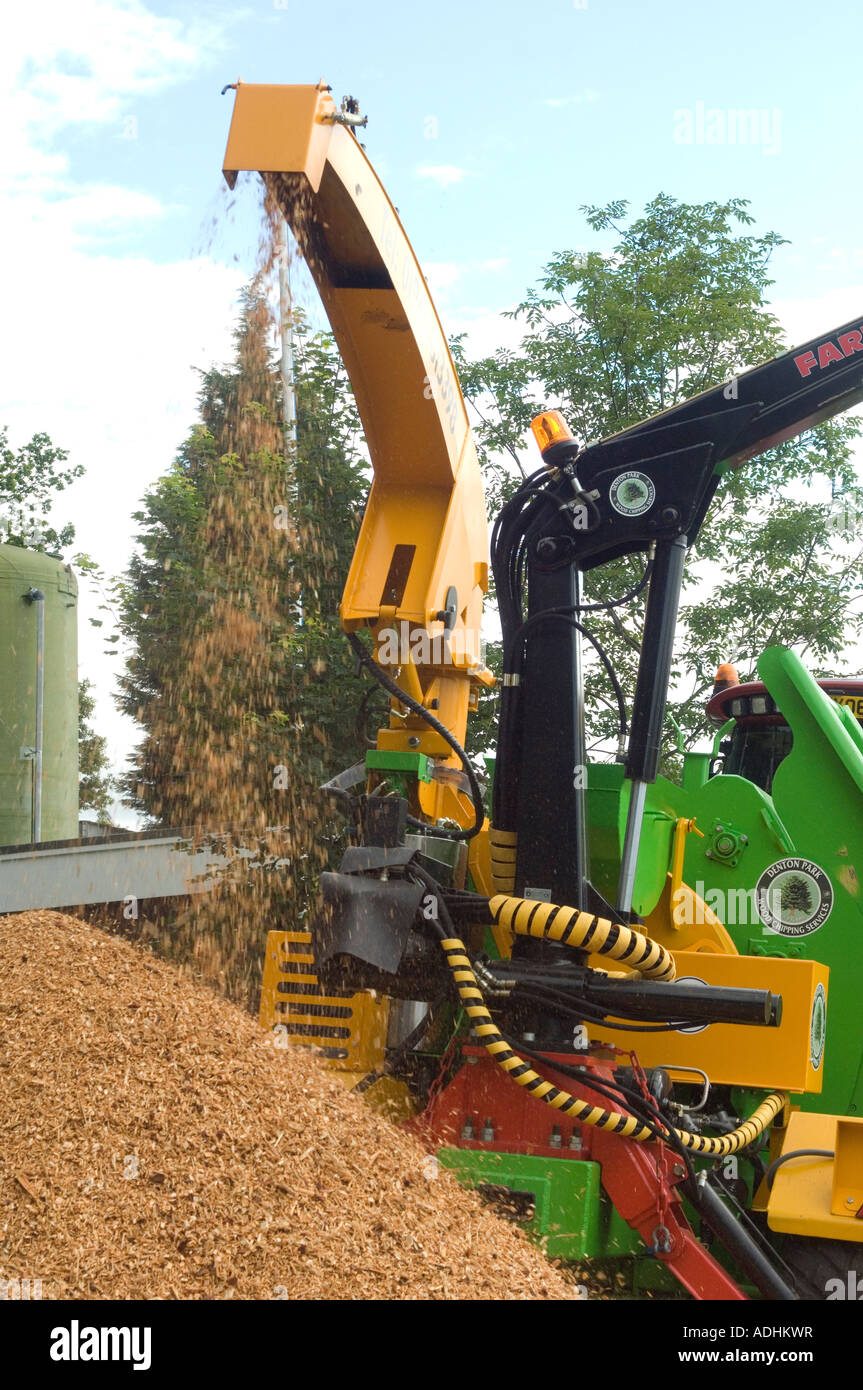 woodchips coming out of spout of a wood chipper Stock Photo - Alamy