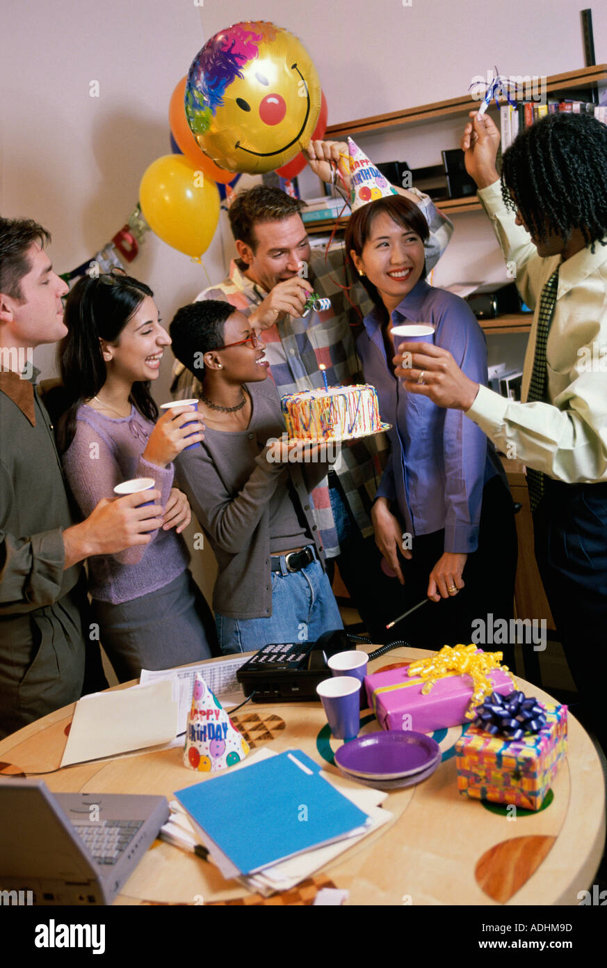 Group of business executives celebrating a birthday in the office Stock ...
