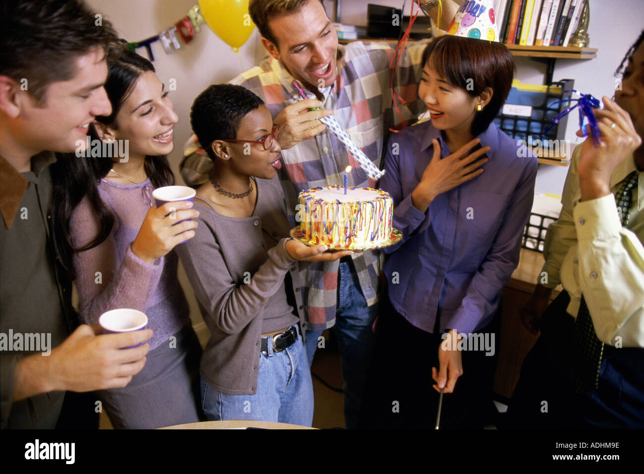 Group of business executives celebrating a birthday in the office Stock ...