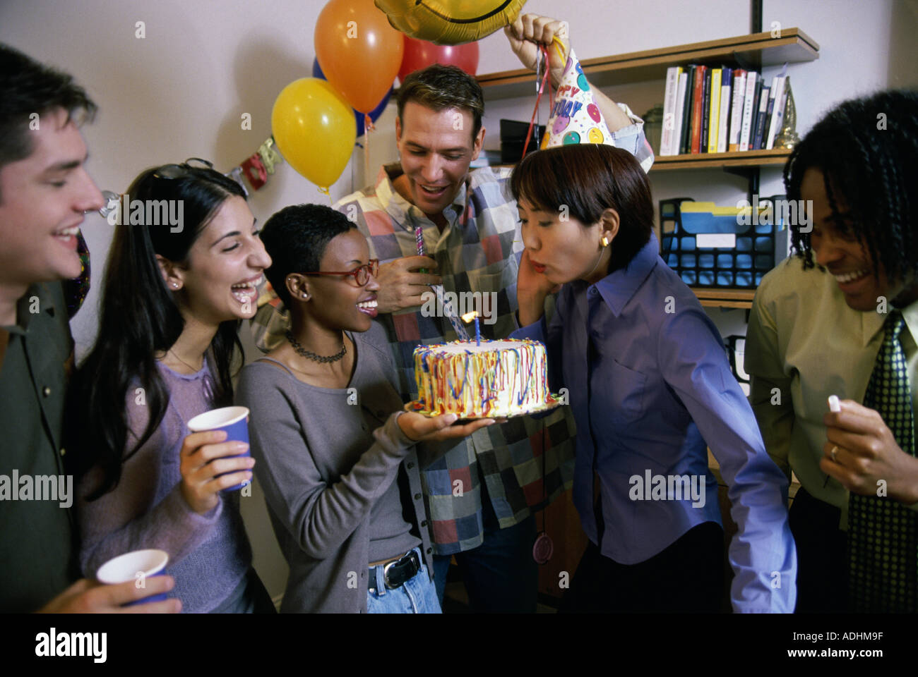 Group of business executives celebrating a birthday in the office Stock ...