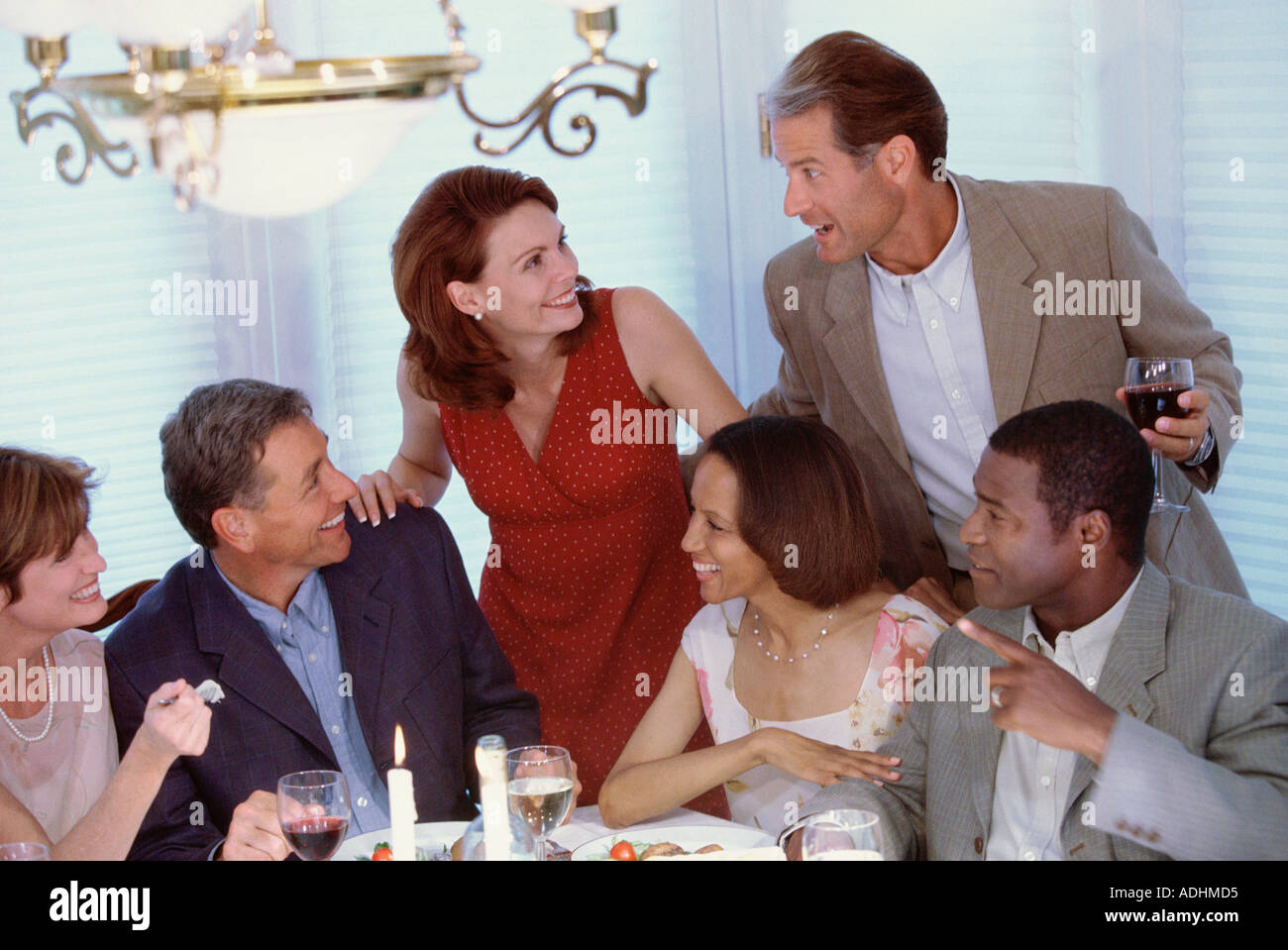 Group of people drinking at a dining table Stock Photo - Alamy