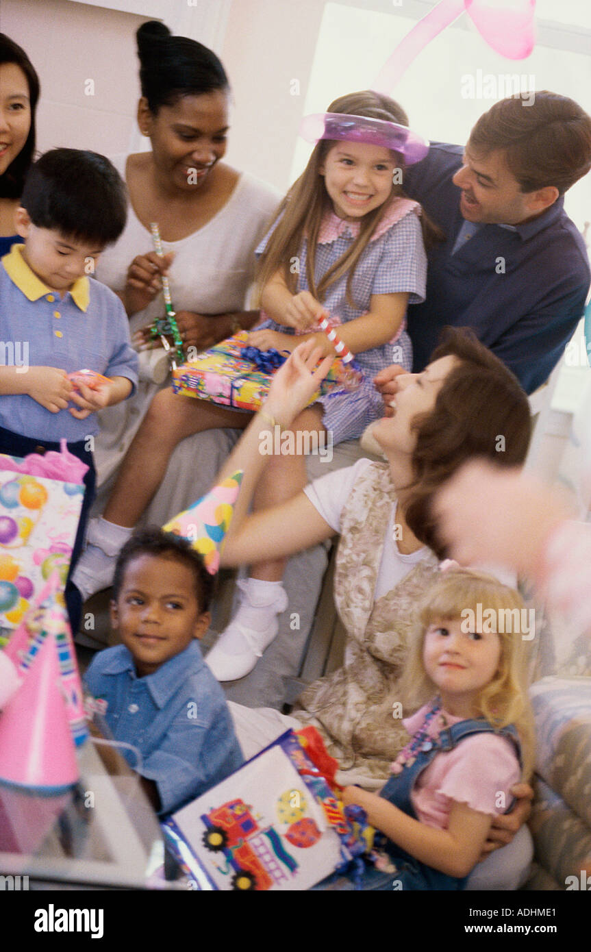 Group of children and their parents at a birthday party Stock Photo - Alamy