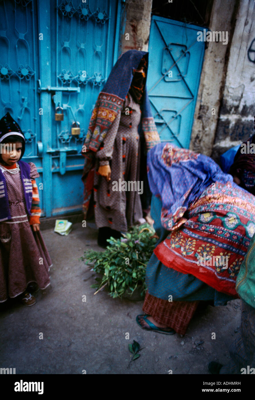 Sana'a Yemen Women wearing Sana'ani Sitrah Dress Shopping at Souk Stock ...