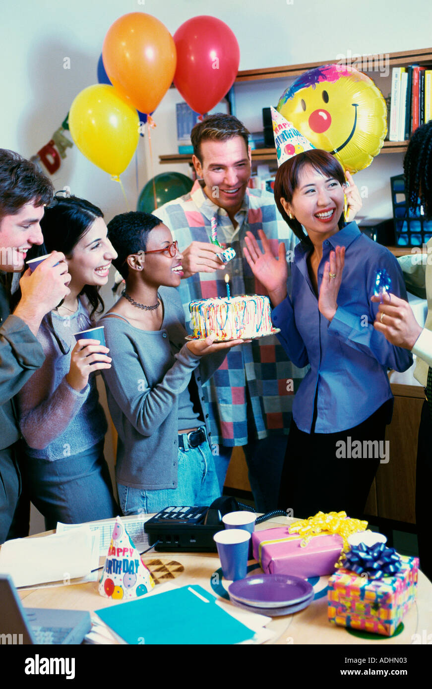 Group of business executives celebrating a birthday in the office Stock ...