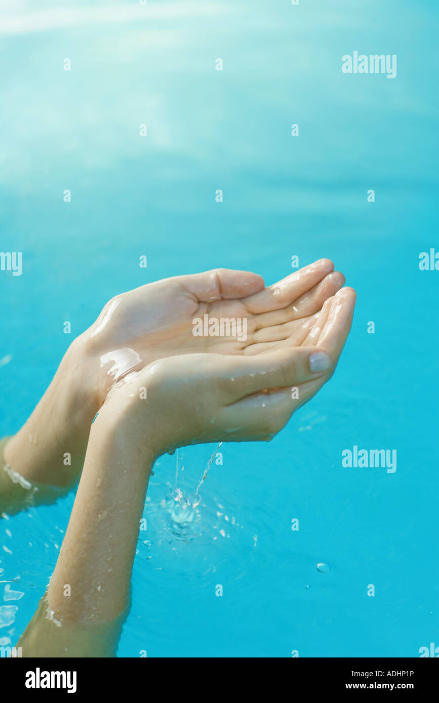 Water dripping from cupped hands hi-res stock photography and images ...