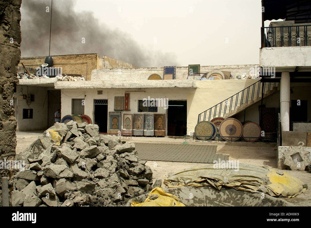 Black smoke rising from a kiln at the ceramic clay works in Fes Morocco ...