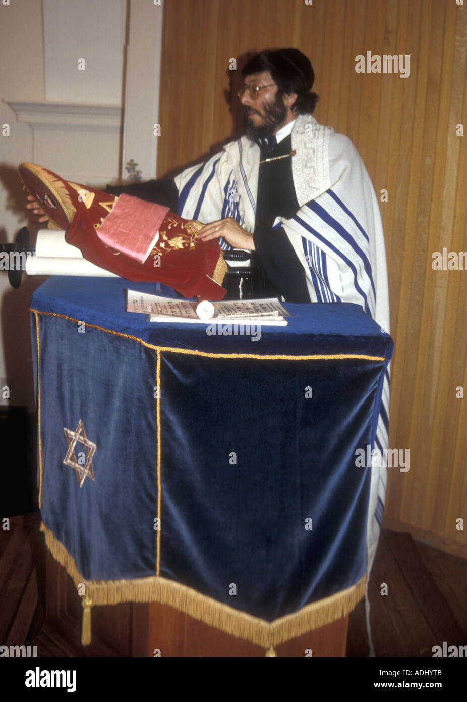 A British rabbi reading from the torah in a Reform Synagogue in south ...