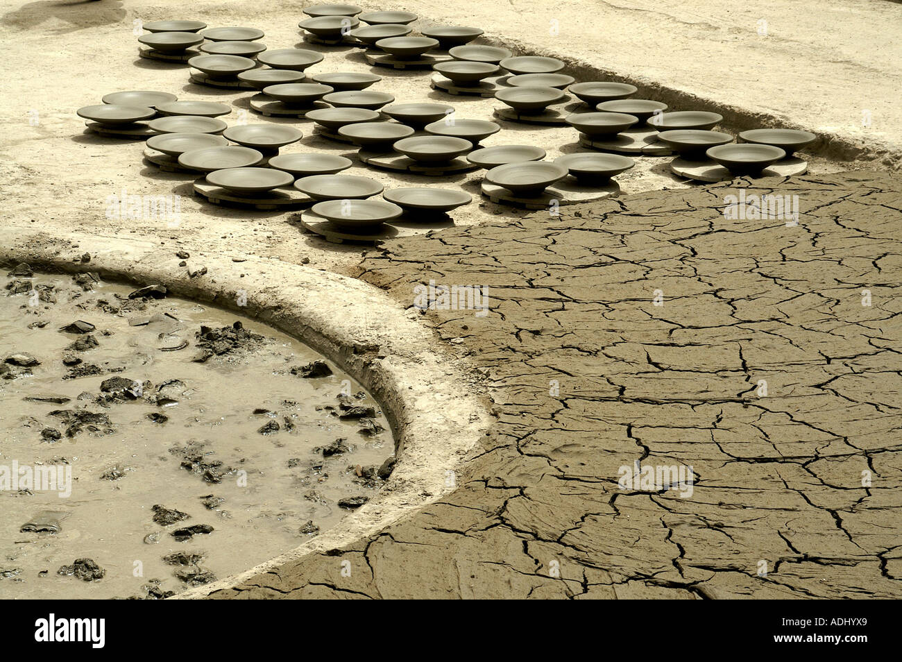 Plates and clay baking in the sun at the ceramic clay works in Fes ...