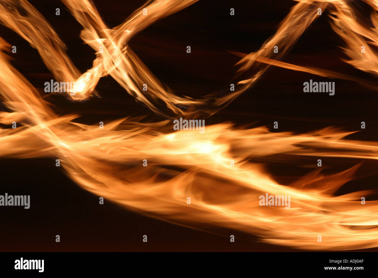 Fire trail makes pattern against black background Stock Photo - Alamy