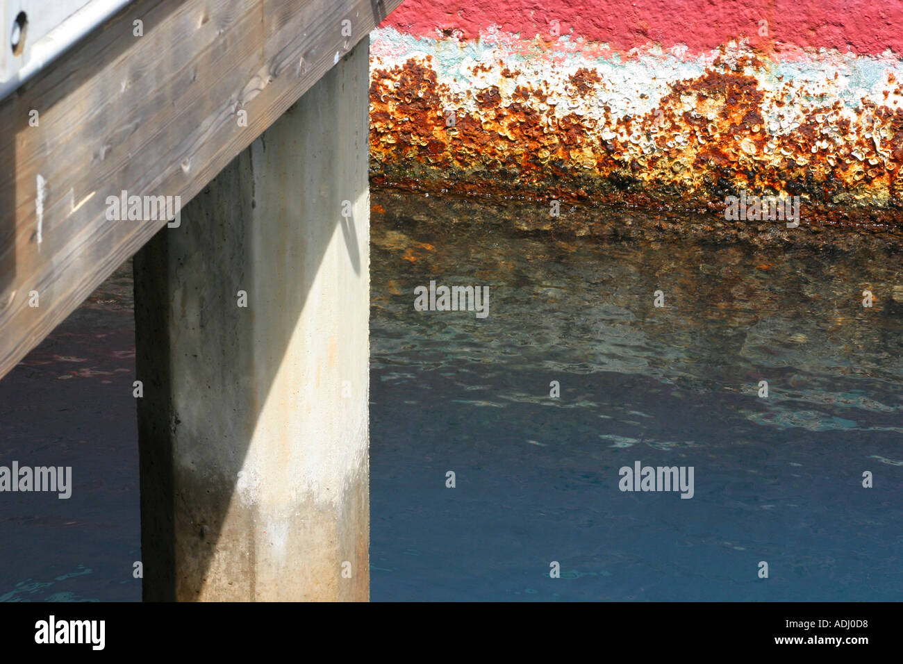 dock and pier with rust over water Stock Photo - Alamy