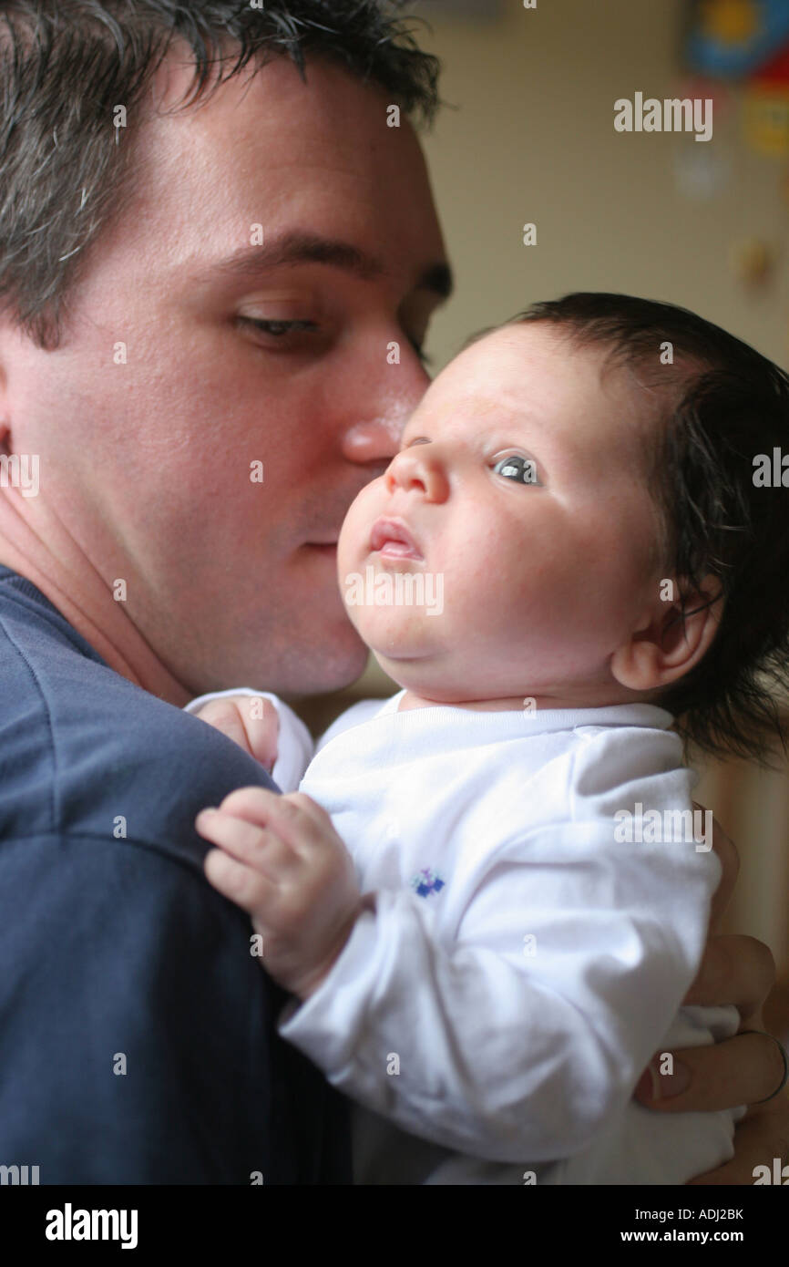 3 Week Old Baby Boy being Held by his Father Wales UK Stock Photo - Alamy