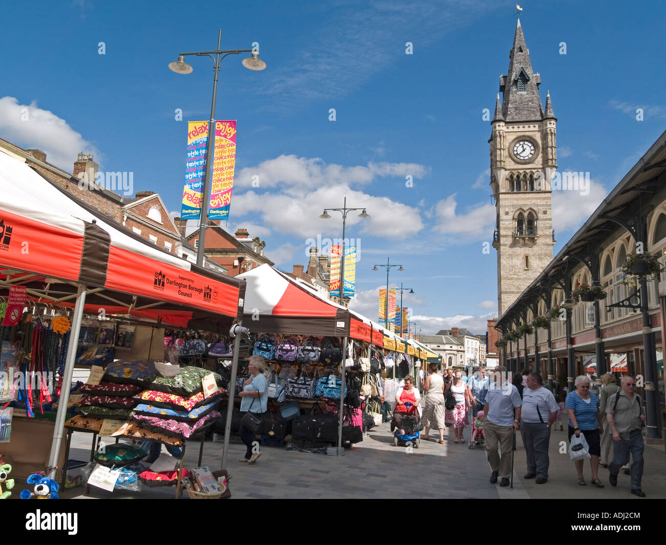 Street market, held outside the covered market and tower clock ...