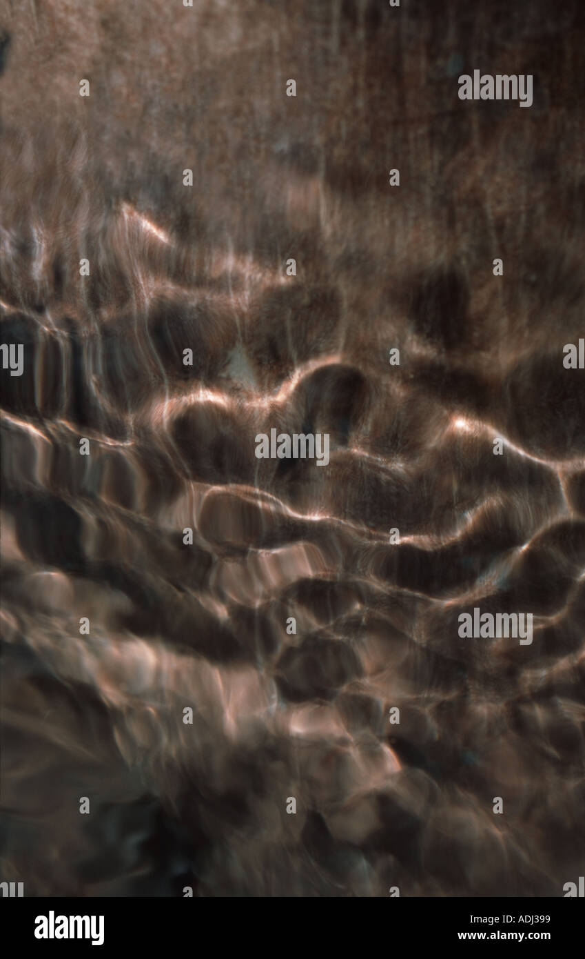 riverbed rock face through river water Stock Photo - Alamy