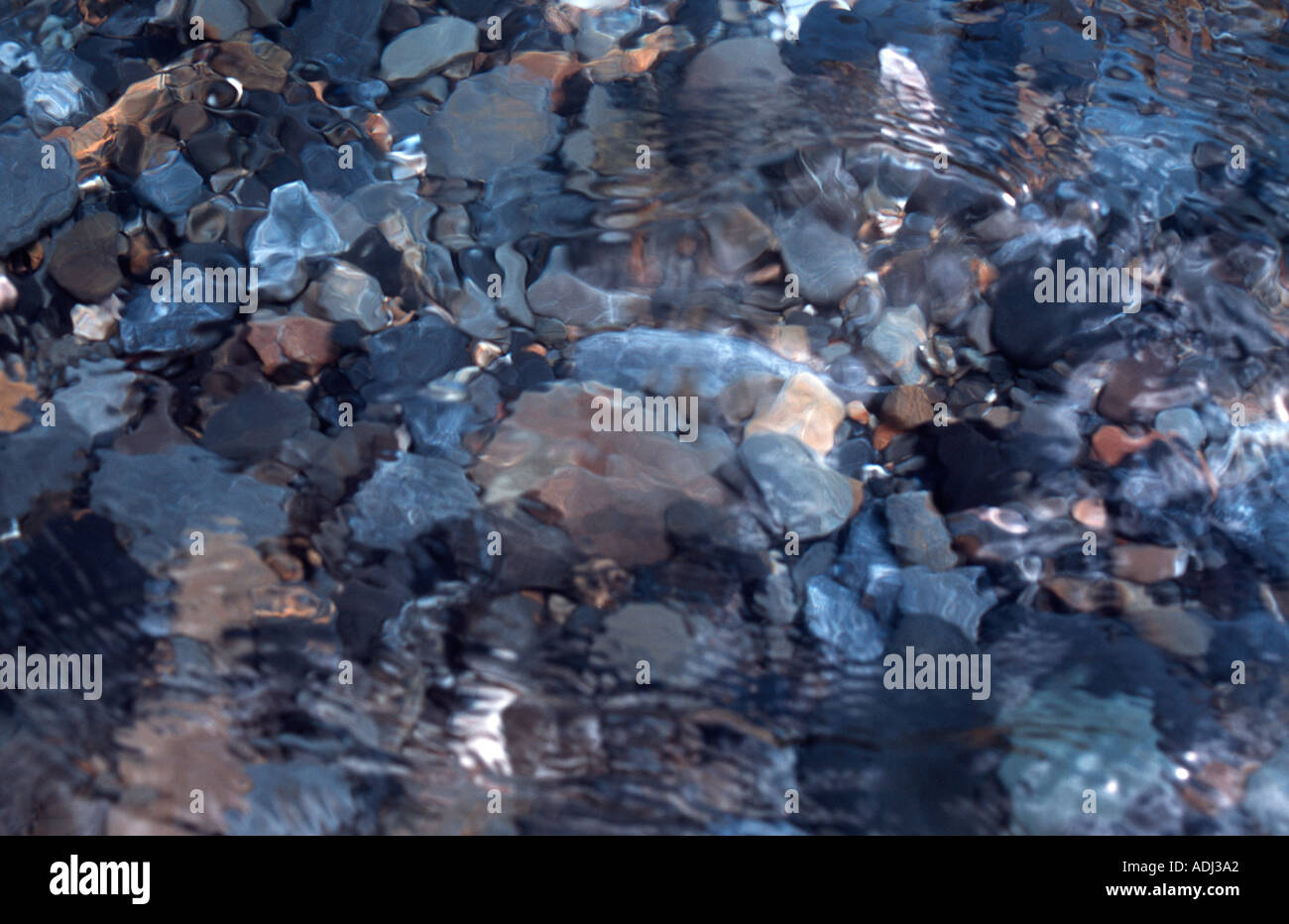 river pebbles through water Stock Photo - Alamy