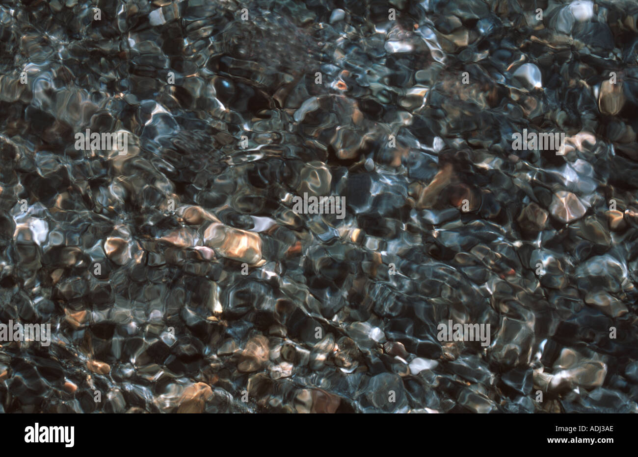 river pebbles through water Stock Photo - Alamy